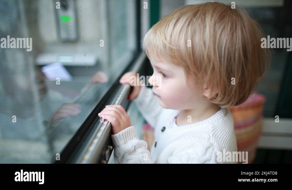 Child looks from a window Stock Videos & Footage - HD and 4K Video ...