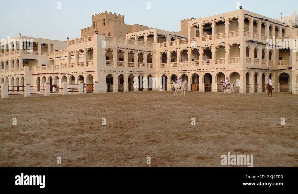 Qatari Arab horse riders training in a paddock near Souq Waqif in Doha ...