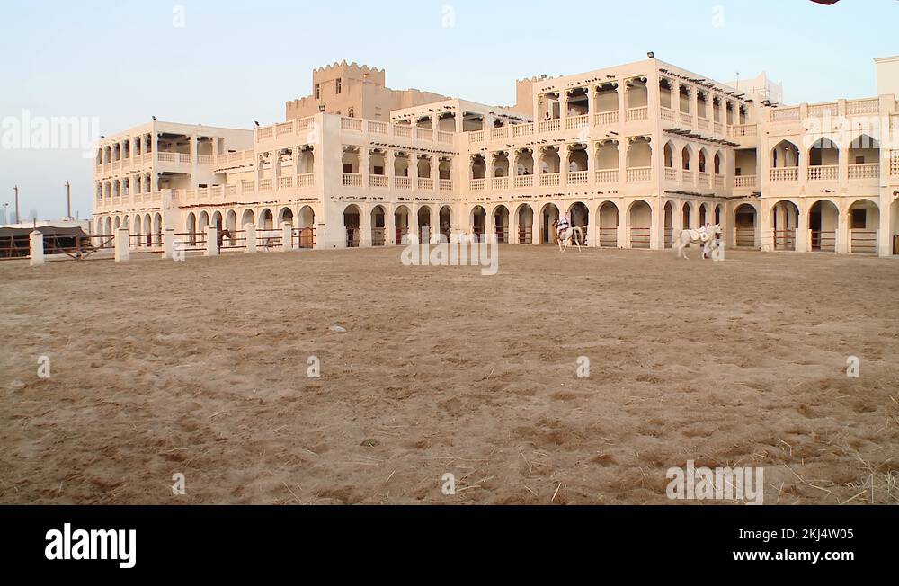 Qatari Arab horse riders training in a paddock near Souq Waqif in Doha ...