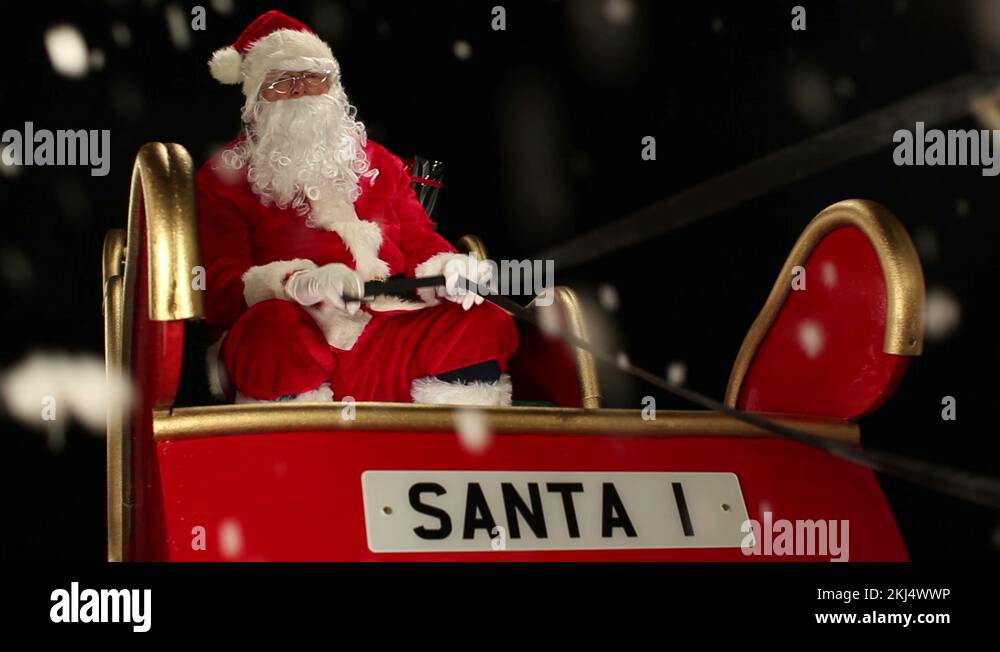 Father Christmas riding in his sleigh and it's snowing - Santa, Front ...