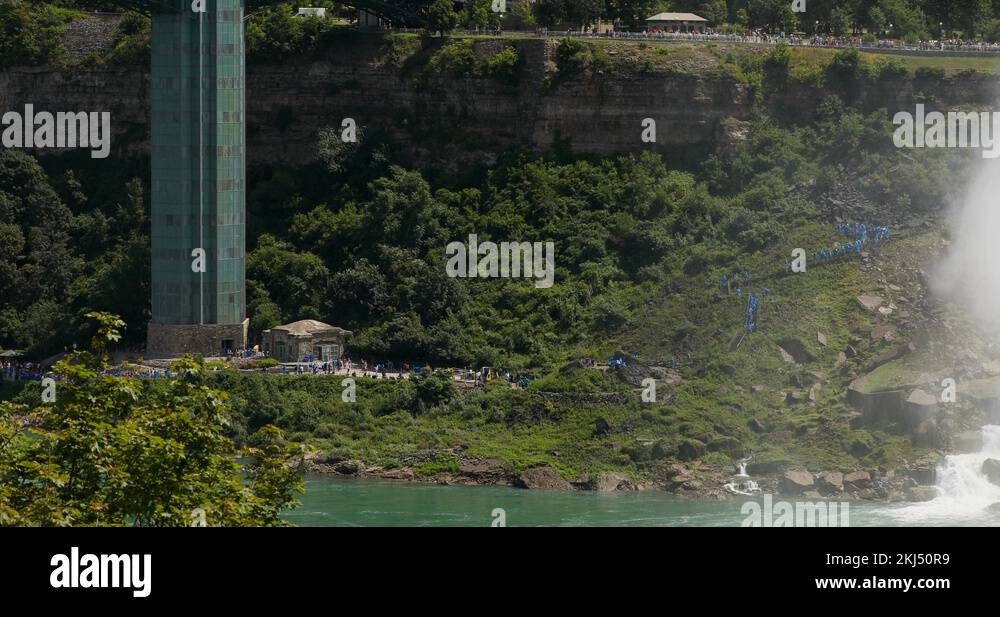 Niagara Falls tourist elevator to river Goat Island waterfall pan 4K ...