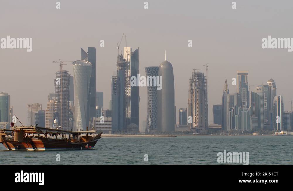 A traditional Arab dhow (boat/ship) anchored in West Bay in Doha, Qatar ...