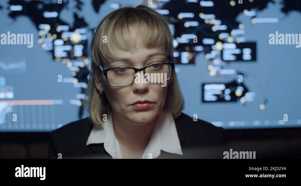 Woman works on computer, coronavirus pandemic. World map counter on TV ...
