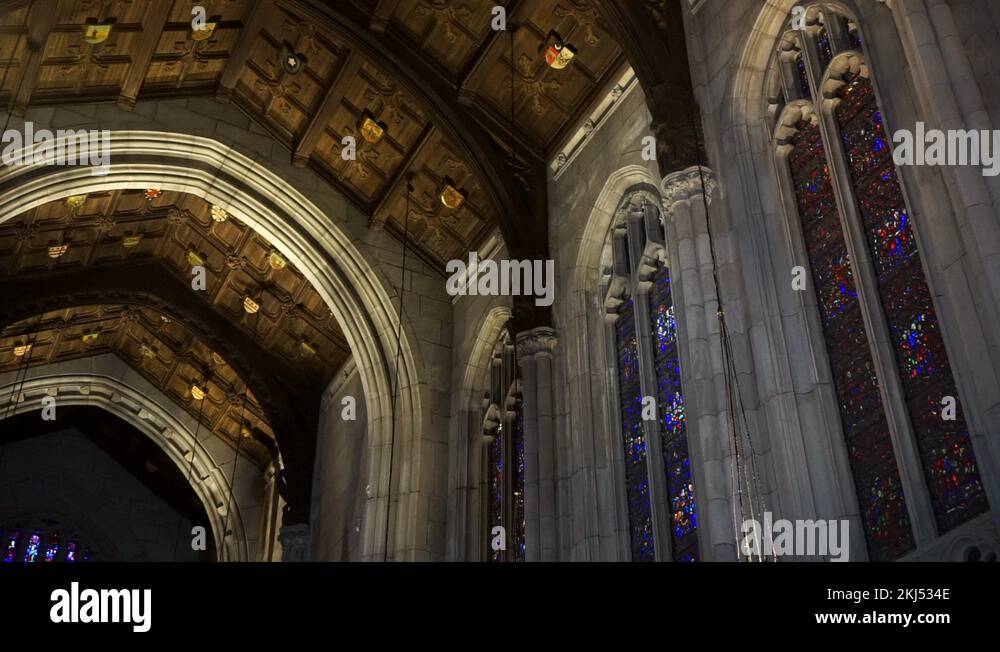 Vaulted cathedral ceiling with wooden panels, and stained glass gothic ...