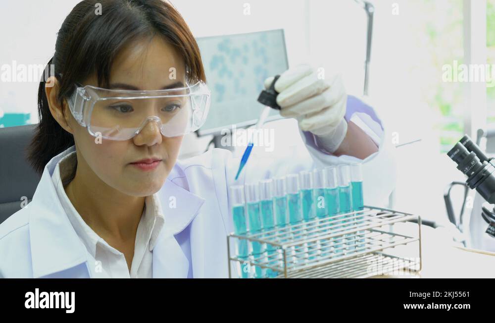 Scientist experimenting chemicals in science laboratory Stock Video ...