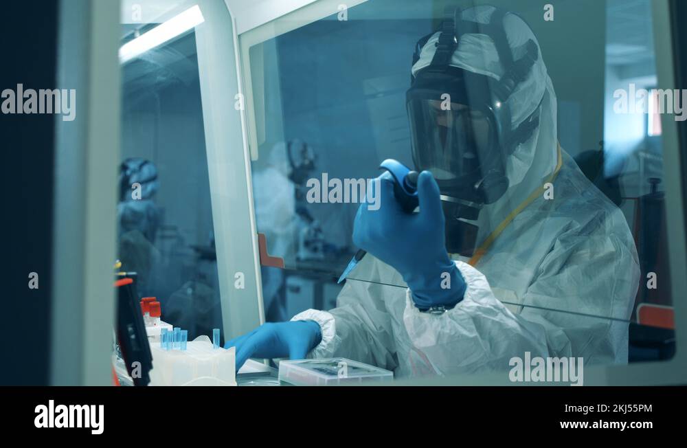 Quantorium worker is doing a research of a test sample. Antibodies ...