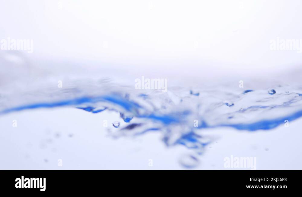 Water splash surface filling the frame with the water drop and waving ...