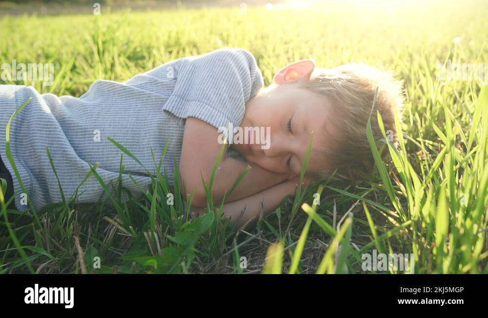 Boy sleeping on the grass Stock Videos & Footage - HD and 4K Video ...