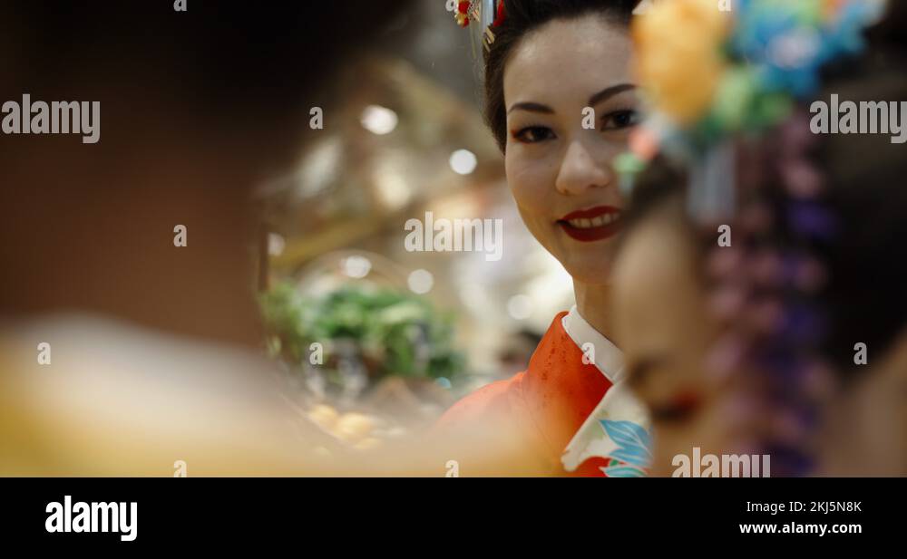 Attractive Japanese Geishas In Traditional Dresses Walking Around