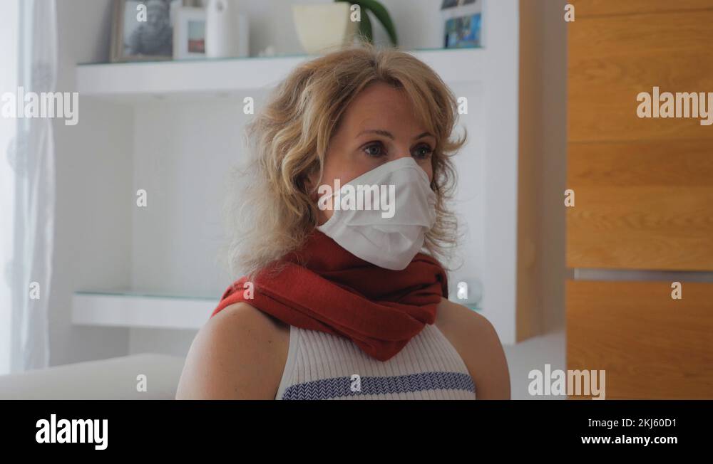 Blond Woman Taking Off Mask and Coughing at Home Stock Video Footage ...