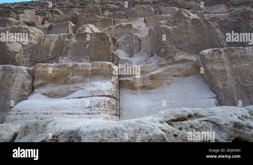 The Great Pyramid of Giza Al Haram Egypt pan from pyramid base low ...