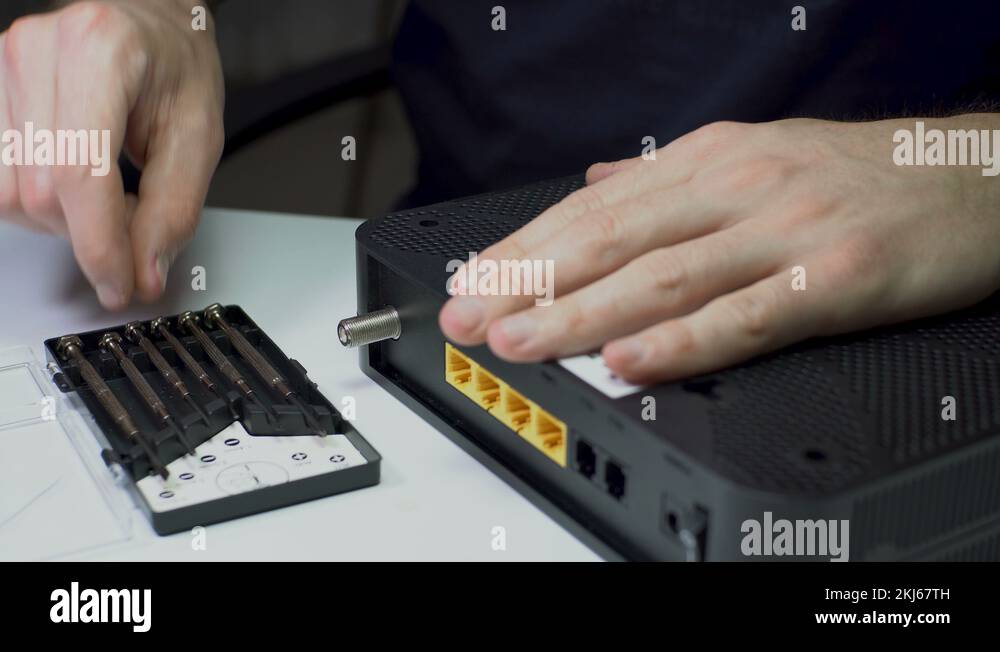 Wi-Fi Modem Electronic Device Repairment with Micro Screwdriver Stock ...