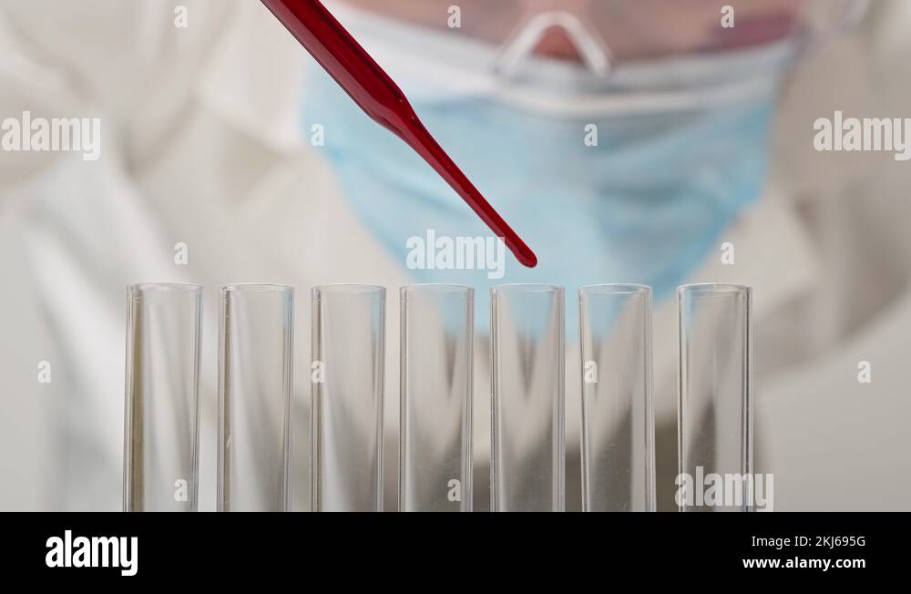Scientist test for virus using tubes in laboratory. Medical worker ...