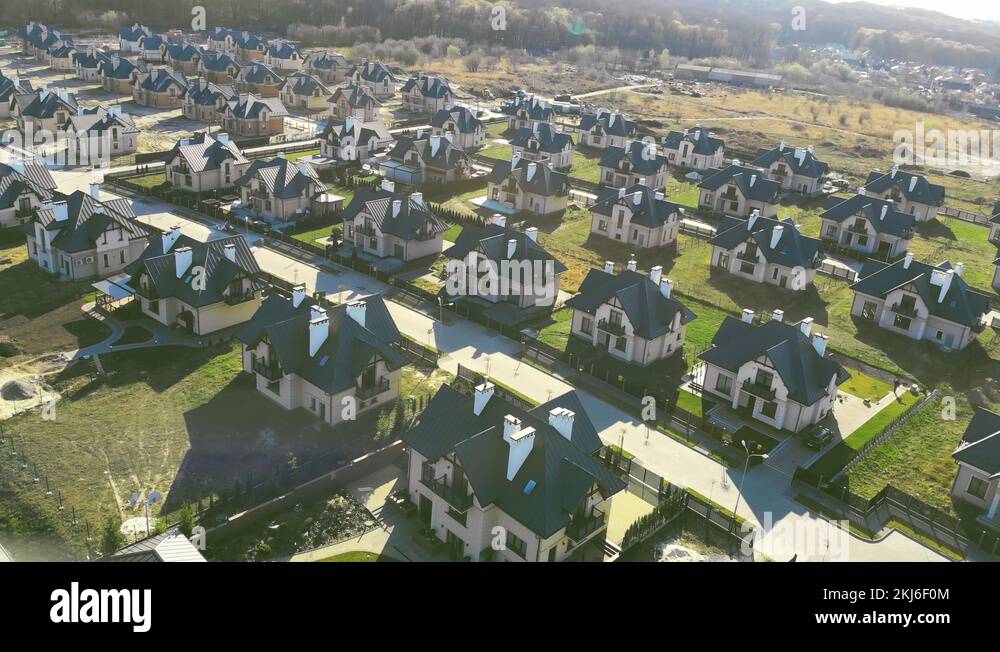 Beautiful settlement of identical houses with beautiful streets near ...