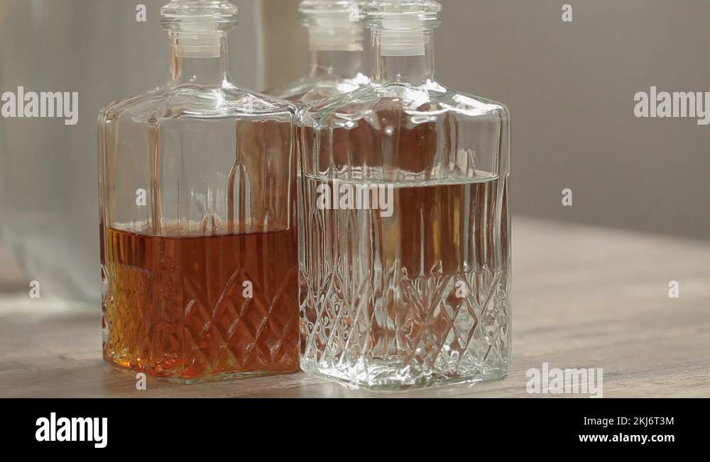 Bottles with self-maded alcohol. Last step of a Distillery Where Final ...