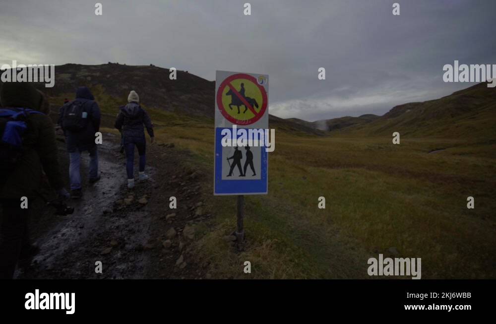VIK, ICELAND, OCTOBER 10, 2019 A tourist group ascends a steep climb ...