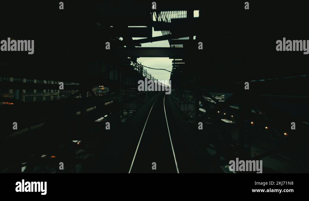Train on railroad exits tunnel in New York. Forward facing pov, process ...