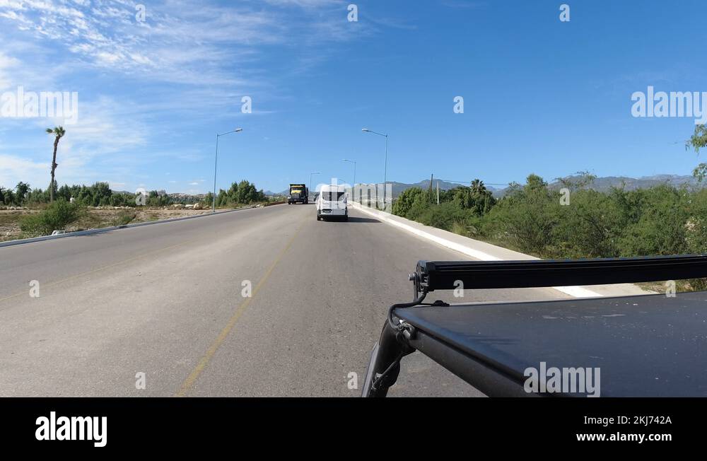 LOS CABOS MEXICO-2019: Clean Road With Green Grass Trees Around And ...