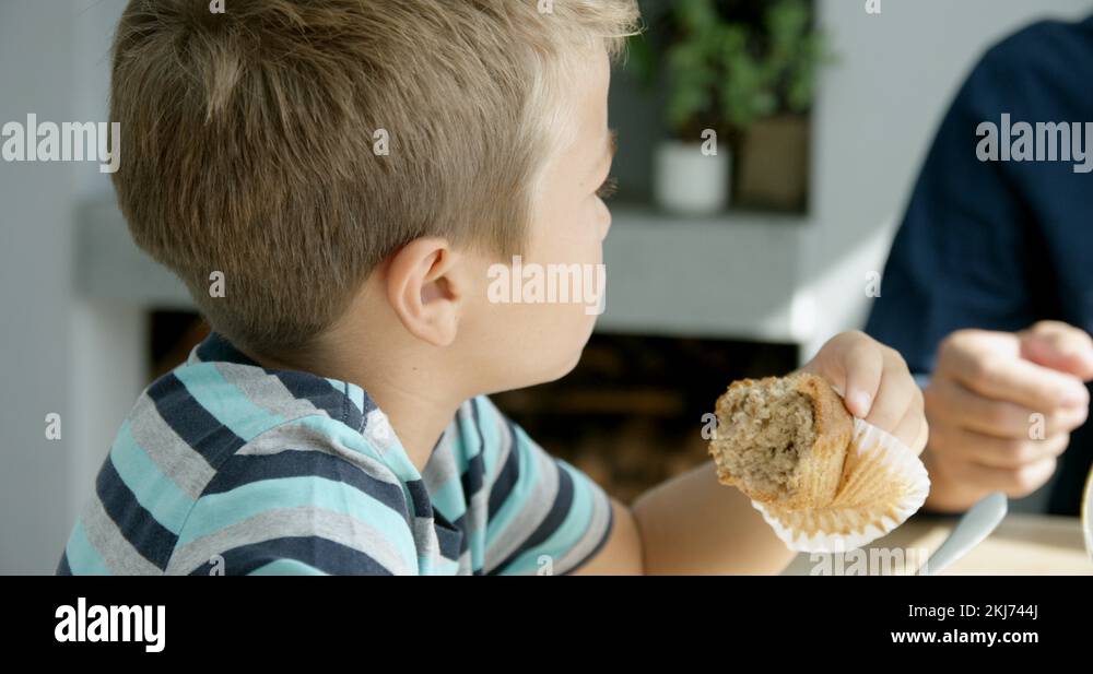 Boy eating muffin Stock Videos & Footage - HD and 4K Video Clips - Alamy