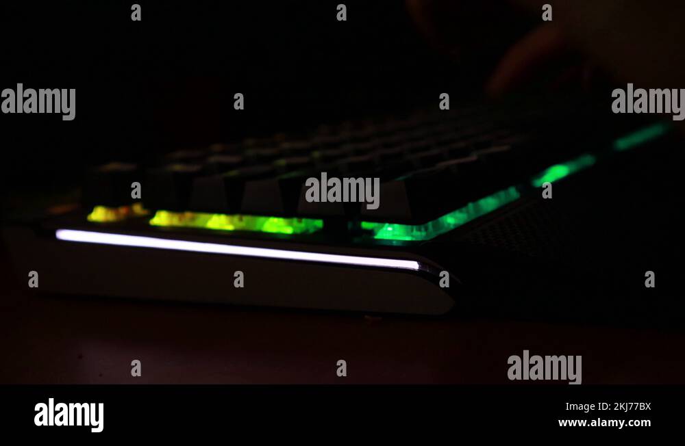 Backlit keyboard at home. Colored light. Mechanical keyboard. Working ...