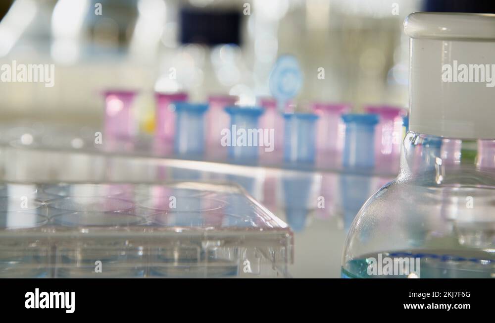 Scientist pipetting a sample into a vial ready for analytical testing ...