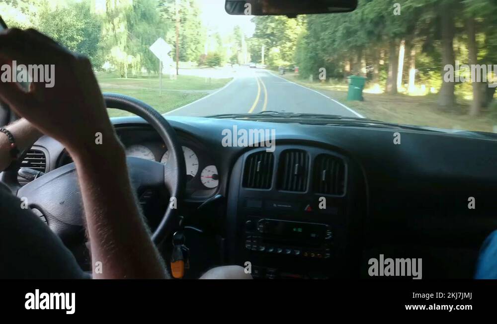 couple driving a beat up used van to cottage country in the summer in ...