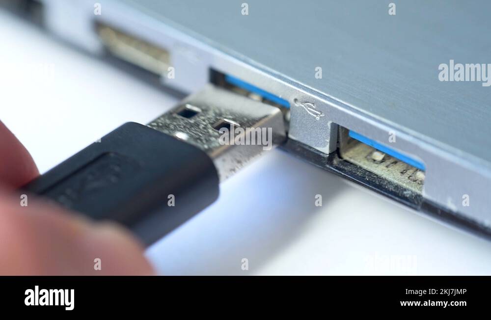 Fingers connecting a usb cable to a laptop port. Macro Stock Video ...