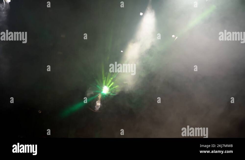Rotating disco ball with multicolor light effect and dense smoke, loop ...