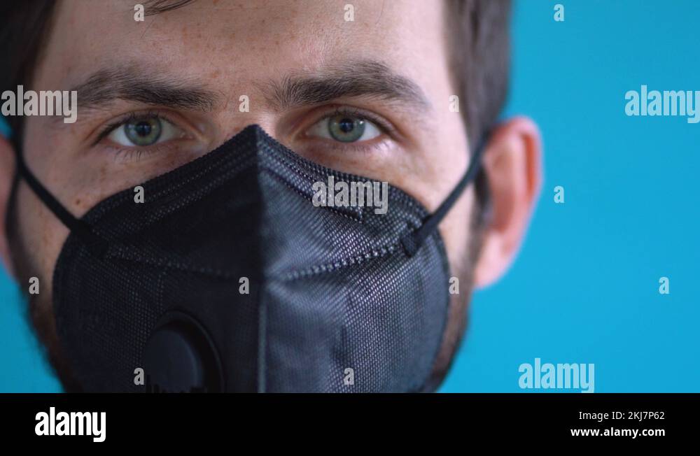 Man take off black face respirator mask slow motion. Guy portrait in ...