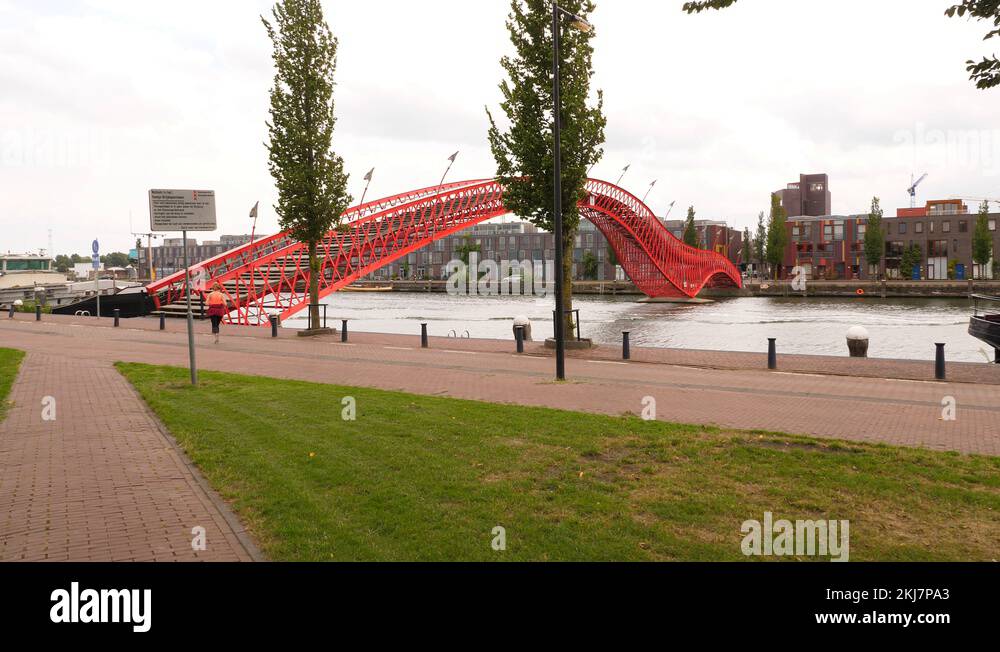 One woman jog to and over Python Bridge, first person view camera Stock ...