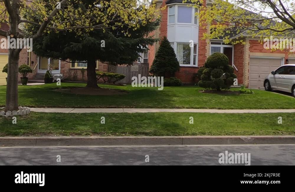 POV side view suburban residential neighbourhood in Markham Canada ...