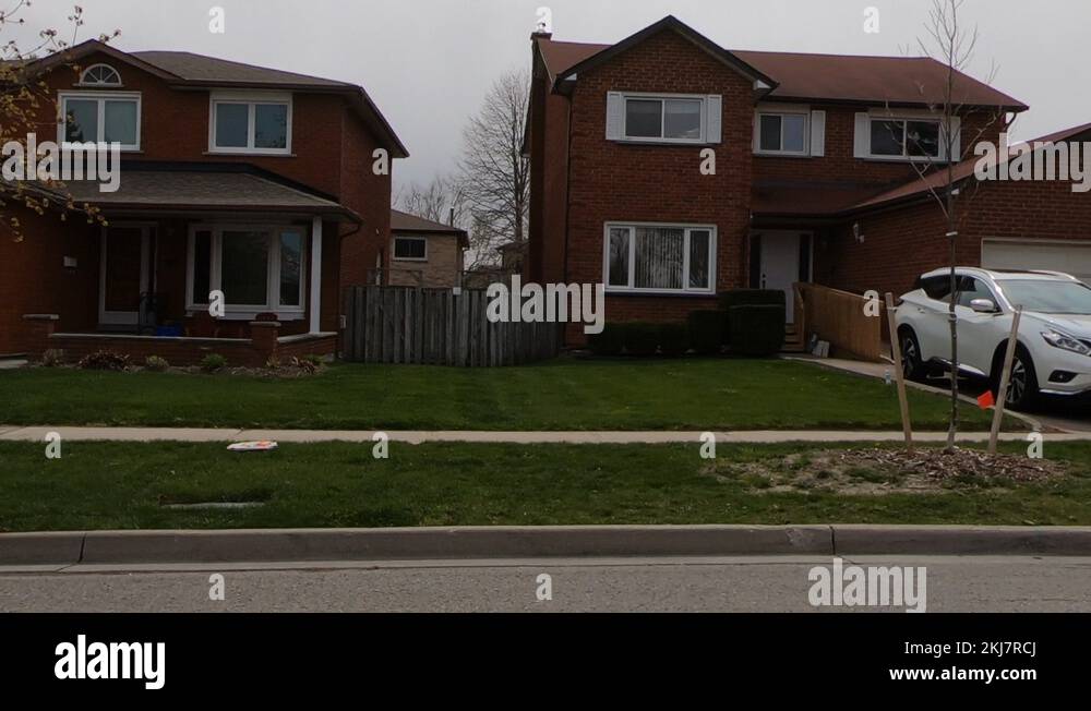 POV side view suburban residential neighbourhood in Markham Canada ...