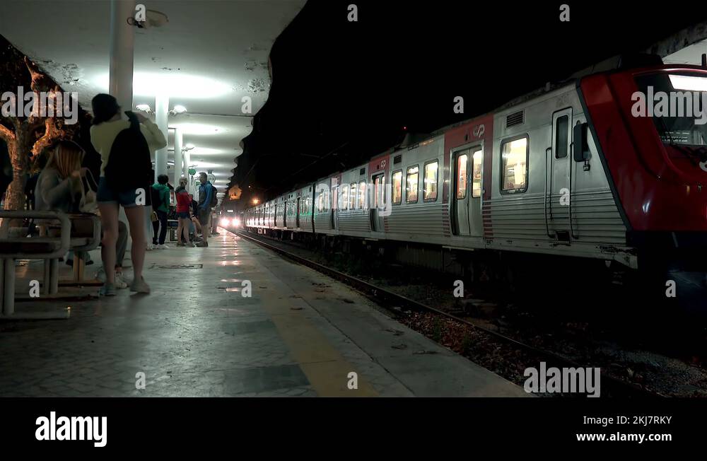 Commuter train arriving the Sintra Railway Station by night. Sintra, Portugal Stock Video ...