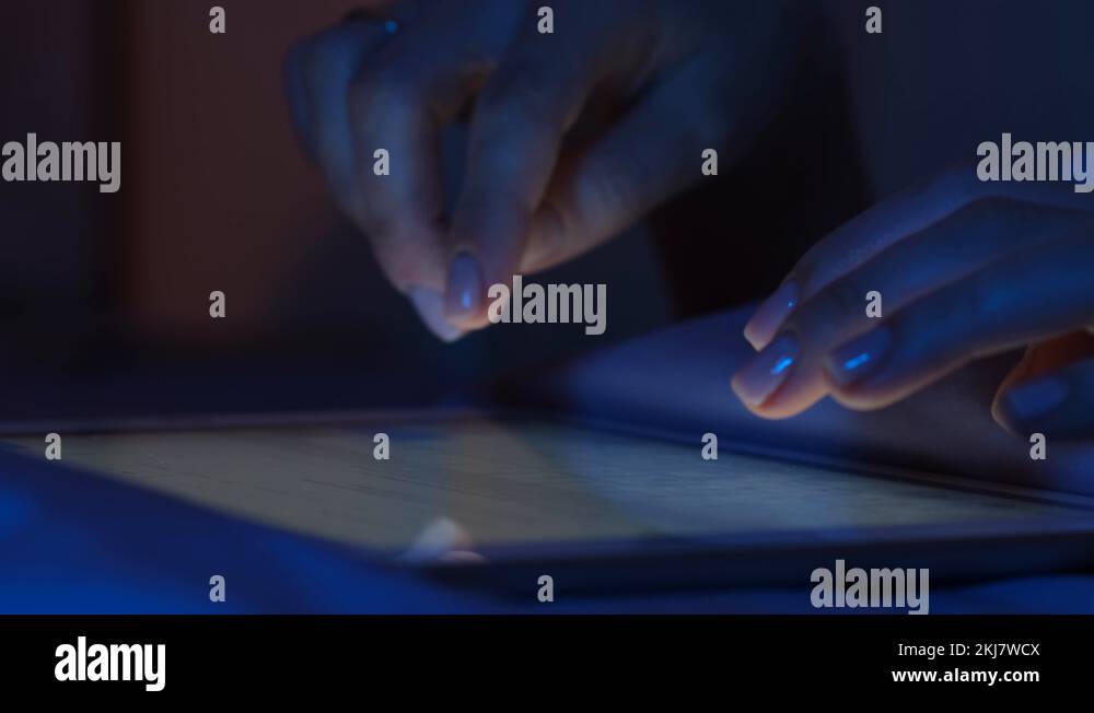 Close-up of tablet device with touch screen, girl is typing text ...