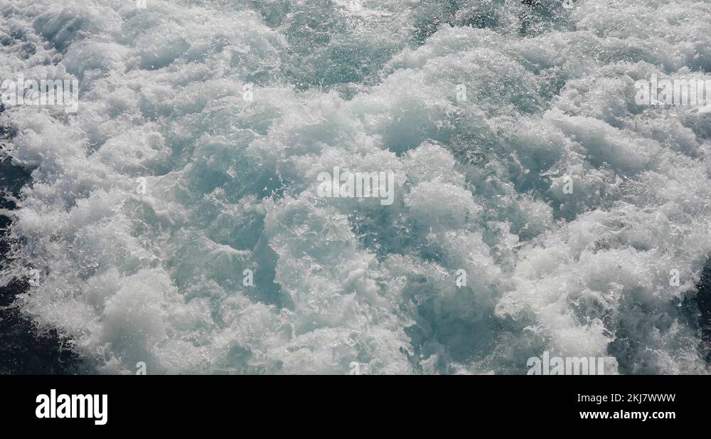 Slow motion of the foamy path from the yacht, the boat goes by sea ...