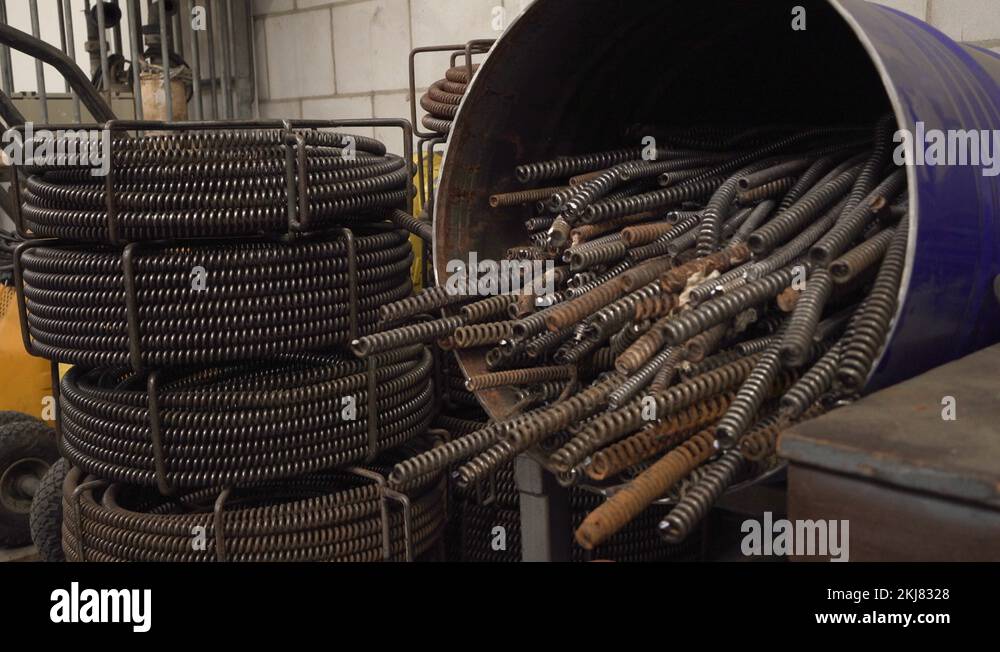 Plumbing snakes stored in a blue drum, slow motion glide shot, HD Stock ...