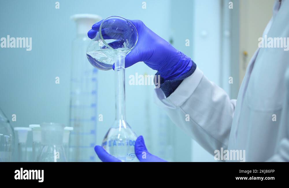Scientist pouring liquid measuring beaker Stock Videos & Footage - HD ...