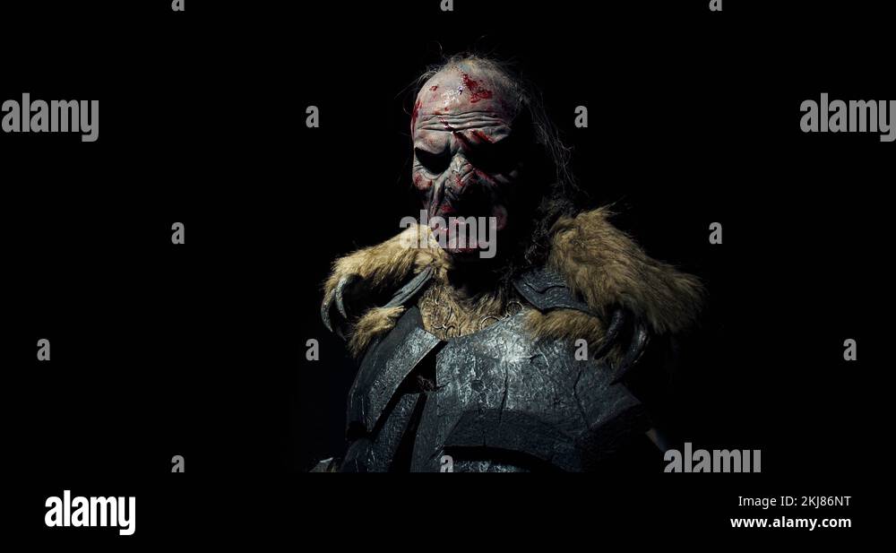 Heavy breathing orc with battle scars and blood on his face, portrait ...