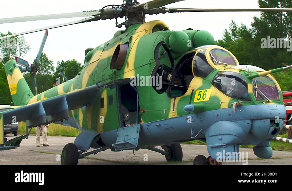 Tractor tows helicopter Mi-24 / Mi-35 (NATO: Hind) in direction of ...