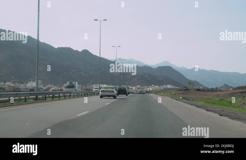 Driving along Highway Road in Muscat. Traffic in Sultanate of Oman ...