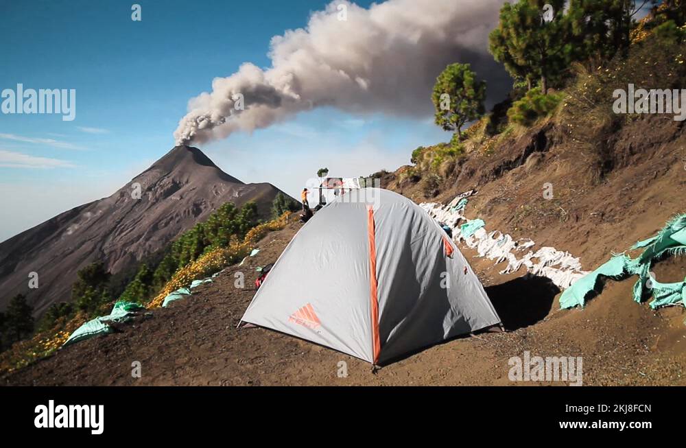 The view from a campsite shows Fuego volcano erupting in close distance ...