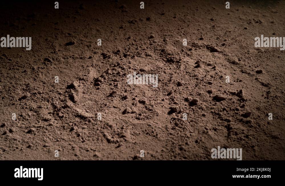 Bible falling onto dusty dirt surface. Shot with Phantom Flex 4K camera ...