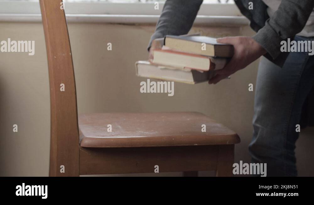 Books on chair Stock Videos & Footage - HD and 4K Video Clips - Alamy