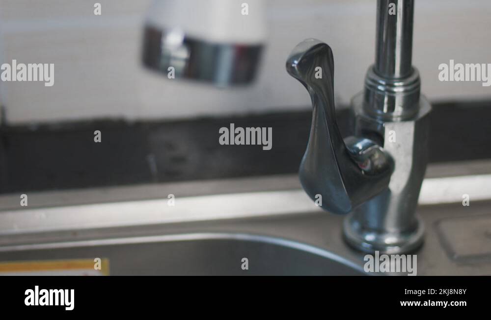 Female Washing Hands Under the Tap in the Kitchen Sink Stock Video ...