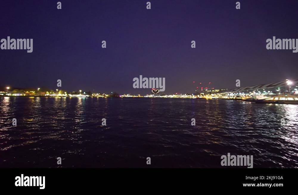 POV From Boat On The IJ In Amsterdam To Reveal ADAM Tower At Night ...