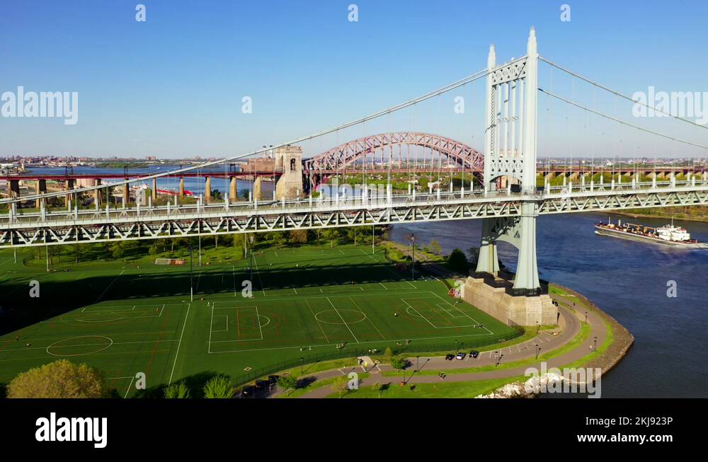 Aerial Crane Shot of the RFK and the Hell Gate Bridge Over the East Riv ...
