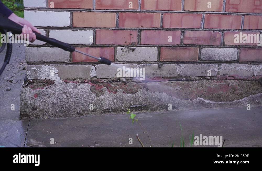 Outdoor floor cleaning with high pressure water jet. care of a country ...