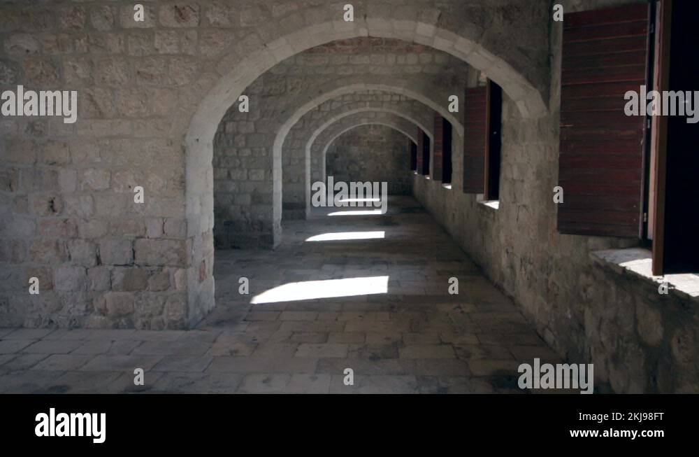 Inside an 11th century fort. the camera pushes forward under the arches ...