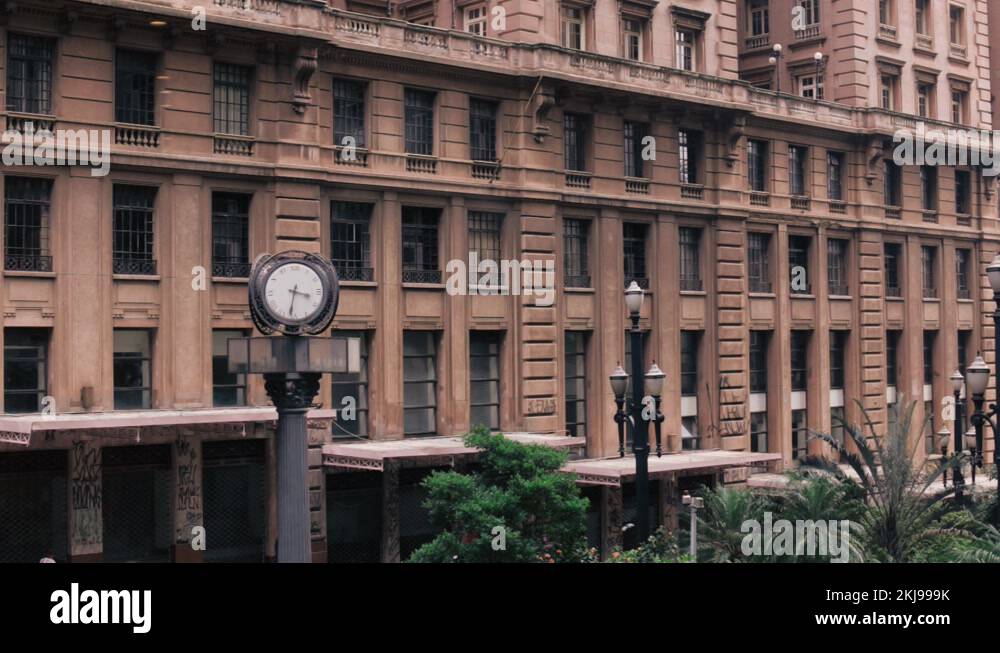 Time lapseof an analog clock and the architecture background of an old ...