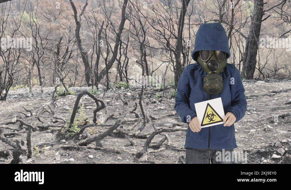 Child with gas mask with bio hazard label in polluted nature Stock ...